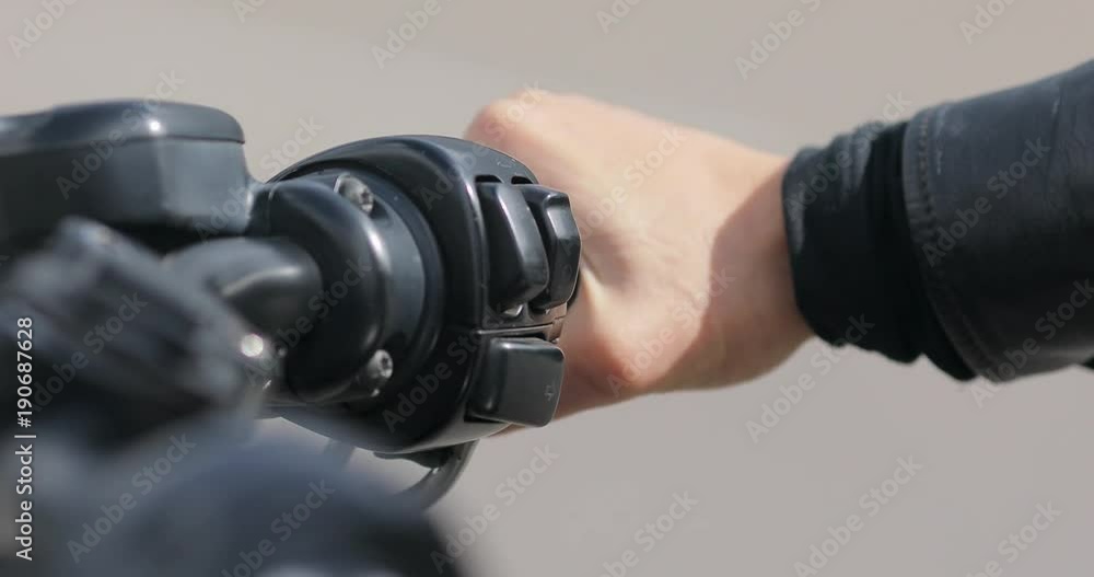 4k Starting motorcycle accelerating hand close up. Female biker twists ...