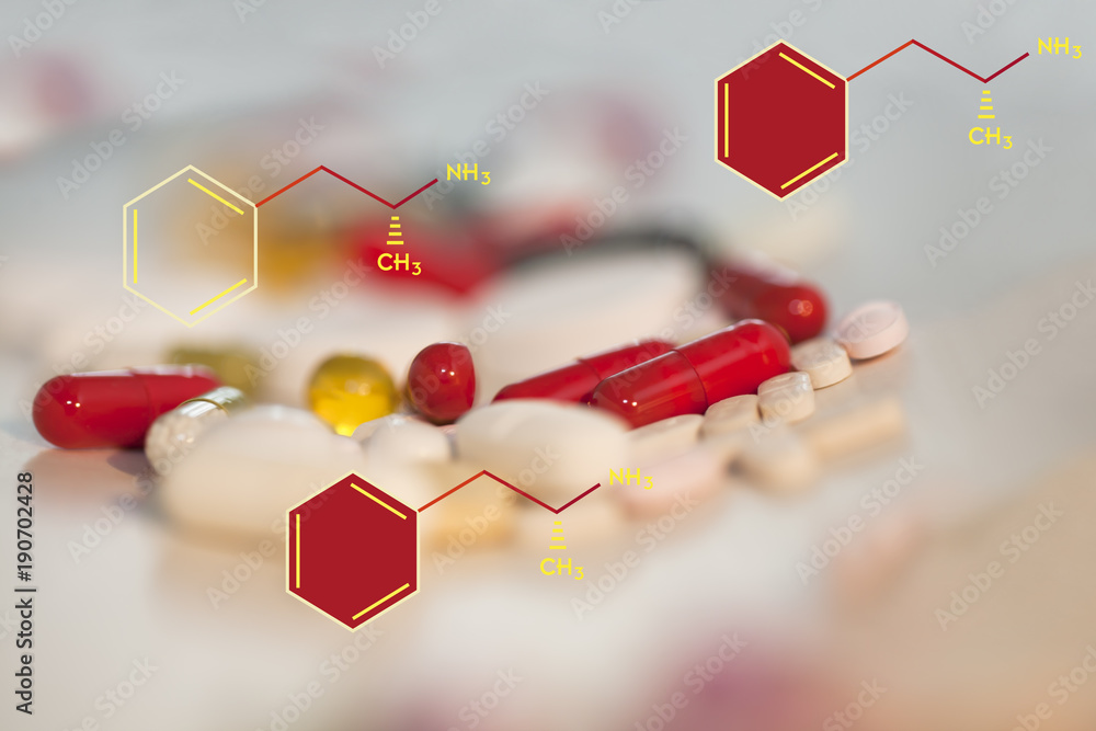 Drug addiction concept. Group of red, white, and yellow tablets and ...