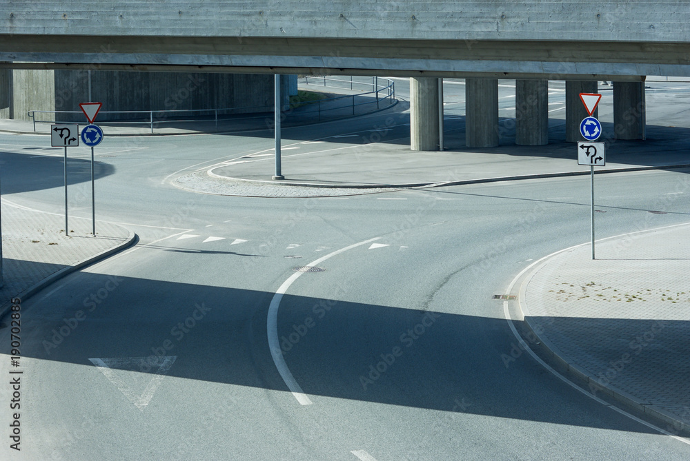 Traffic junction with road signs on asphalt and concrete background ...