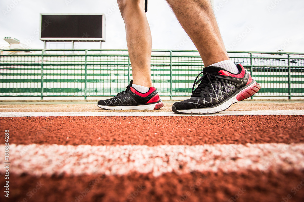 Exercise by jogging, stepping foot at the stadium Stock Photo | Adobe Stock