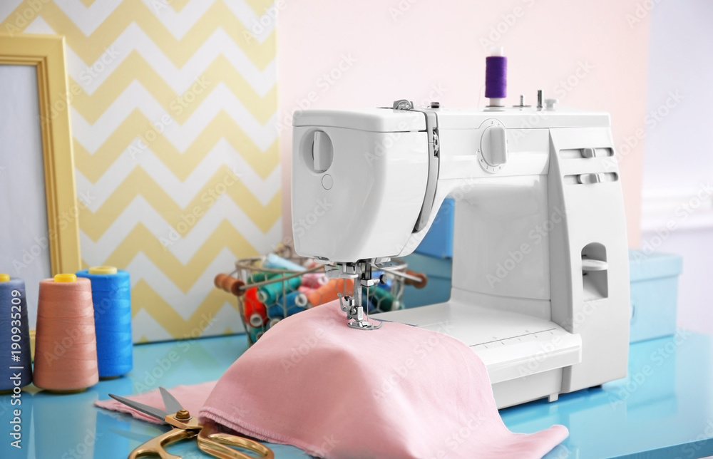 Tailor desk with modern sewing machine Stock Photo | Adobe Stock