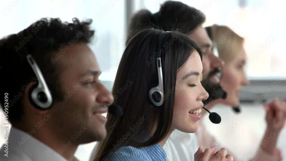 Vídeo do Stock: Female asian dispatcher working amoung collegues ...