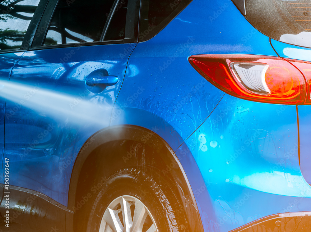 Car washing with high pressure water. Car care service business concept ...