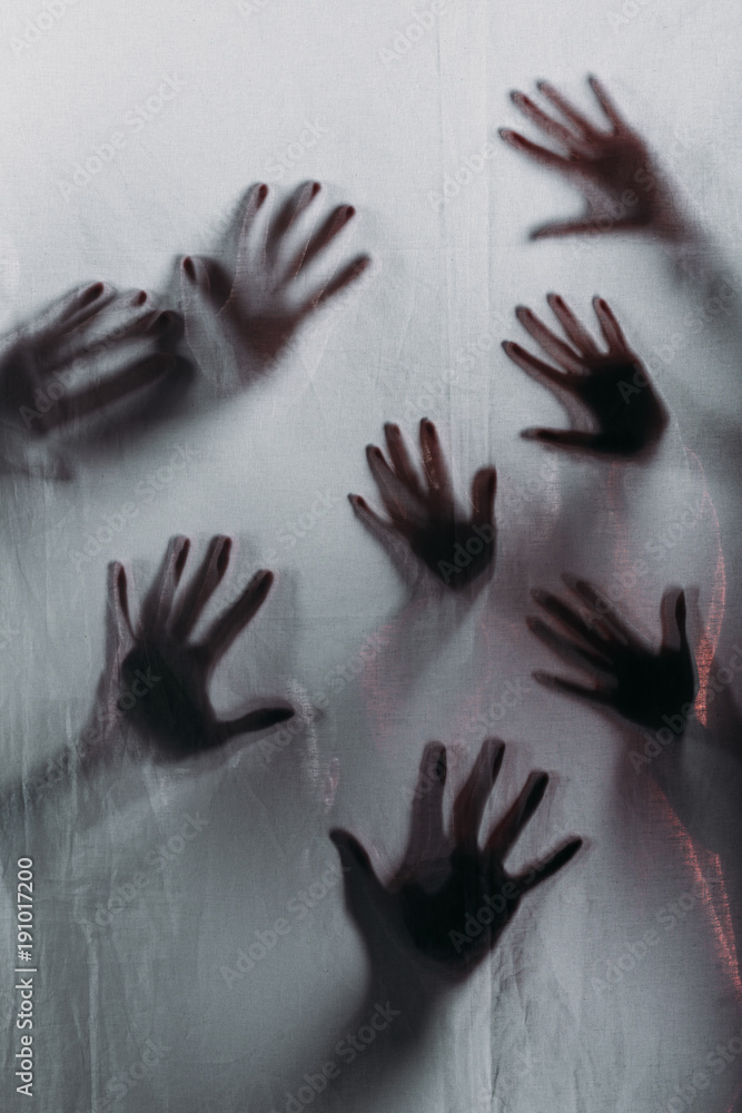 blurry scary silhouettes of human hands touching frosted glass Stock ...