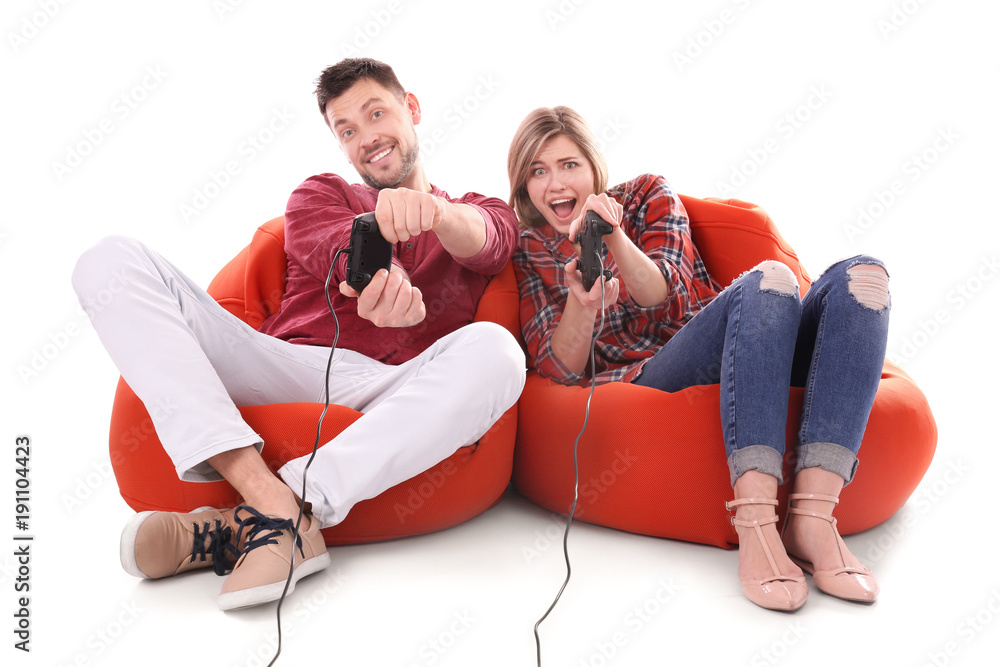 Emotional couple playing video game on white background Stock Photo ...
