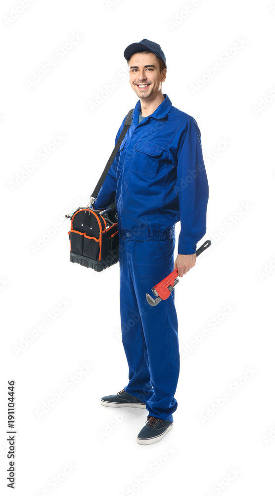 Young plumber in uniform with tool bag and pipe wrench on white ...