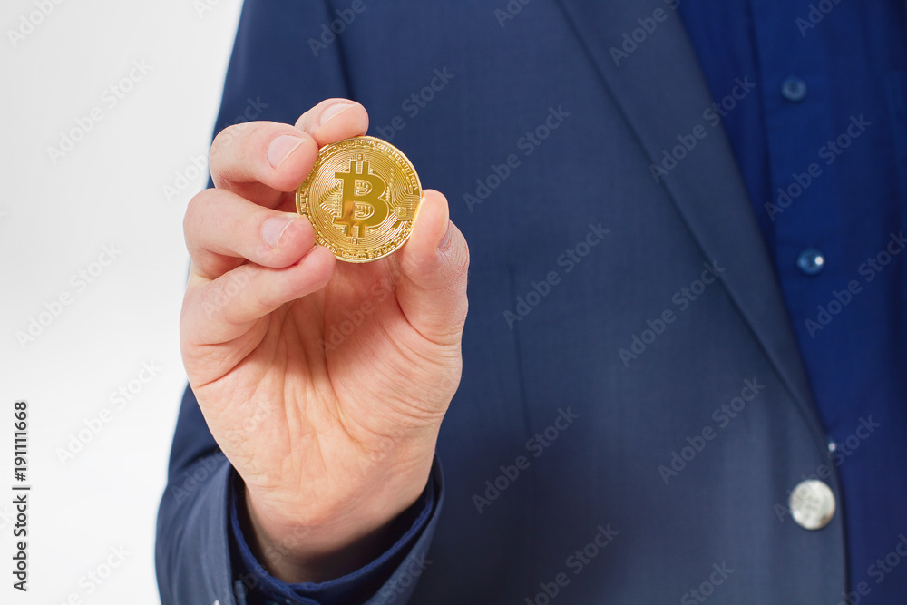 Stylish Man in suit holding gold bitcoin coin isolated on white ...