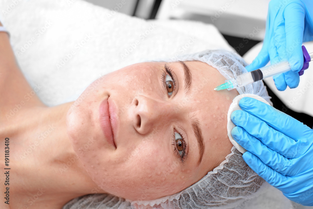 Beautician making injection in woman's face, closeup. Biorevitalization ...