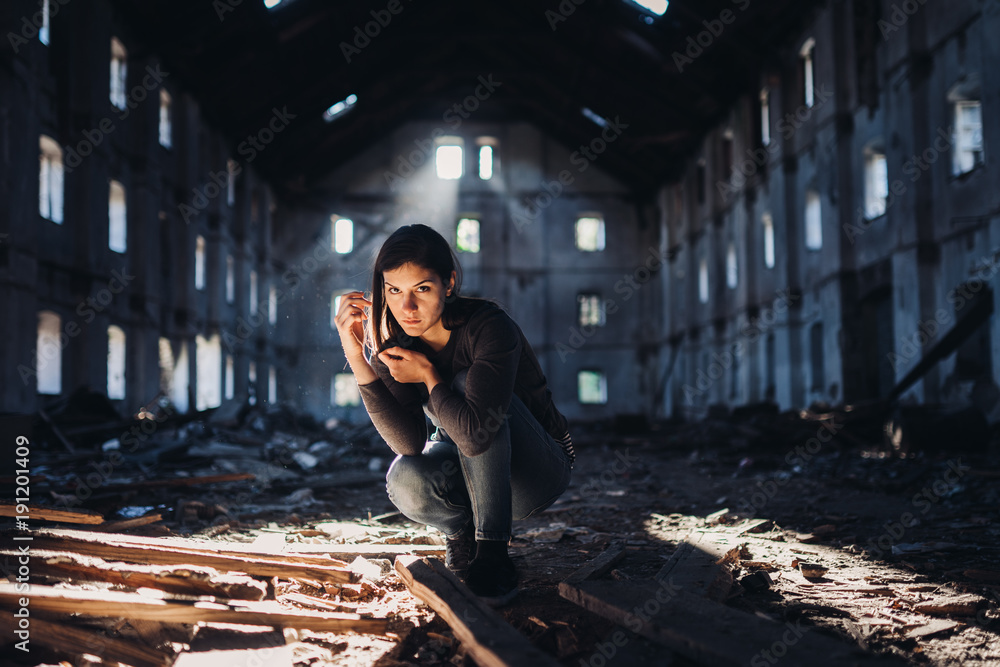 Screaming anxious person in abandoned destroyed building crying ...