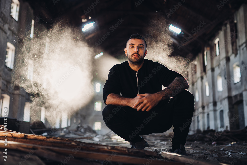 Sad depressed person in abandoned destroyed building crying.Emotional ...