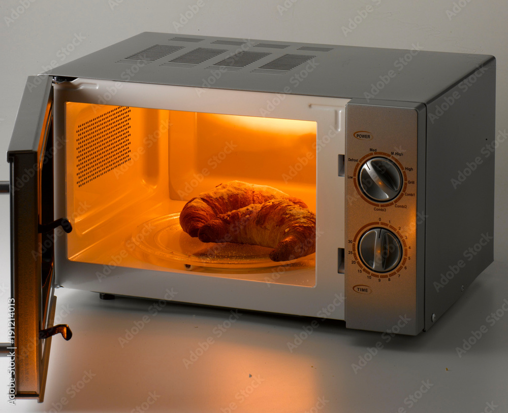 Photo & Art Print croissants on a plate into an open microwave oven, gupi