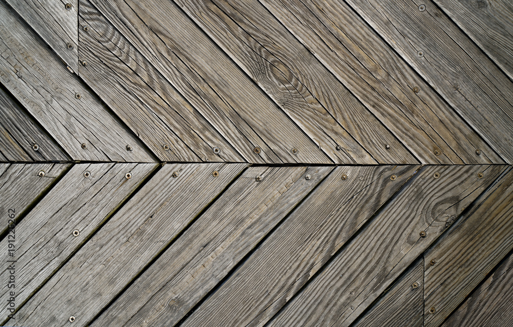 Diagonal lines in wood floor or boardwalk. Screwed planks at an angle ...