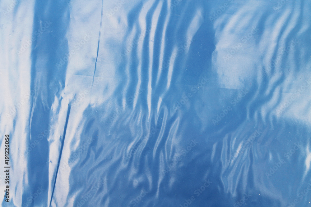 Blue texture of plastic (latex) with reflections and bubbles, similar ...