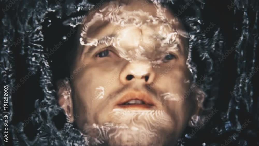 the human head visible through the prism of water Stock Video | Adobe Stock