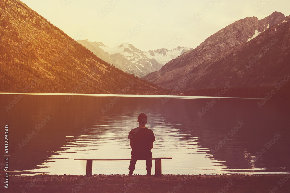 man sitting alone on park bench Stock Photo | Adobe Stock