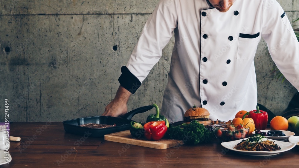Chef cooking in the kitchen. Stock Photo | Adobe Stock
