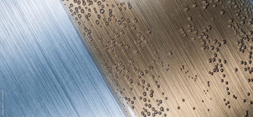 spilled Liquid air bubbles on brushed metal abstract background Stock ...