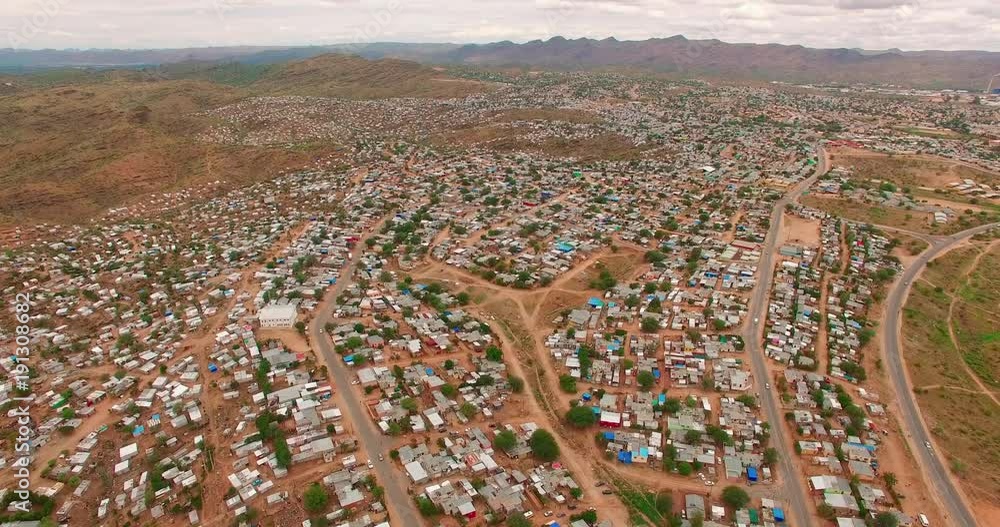 A bird's-eye view taken over a city with ruined houses in Namibia ...