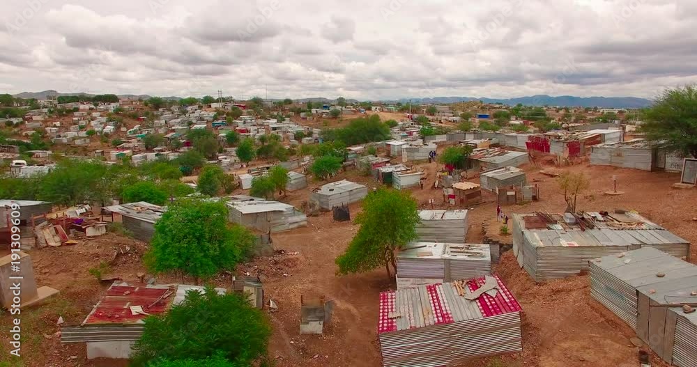 A bird's-eye view taken over a city with ruined houses in Namibia ...