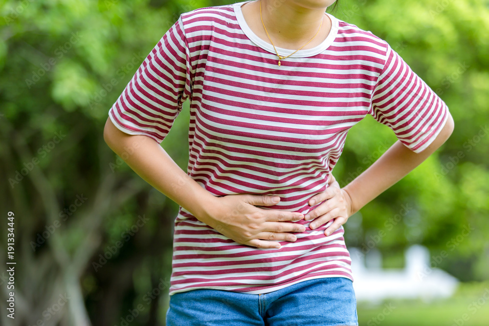 Women with menstrual pain ( or Period cramps ) on his natural outdoor ...