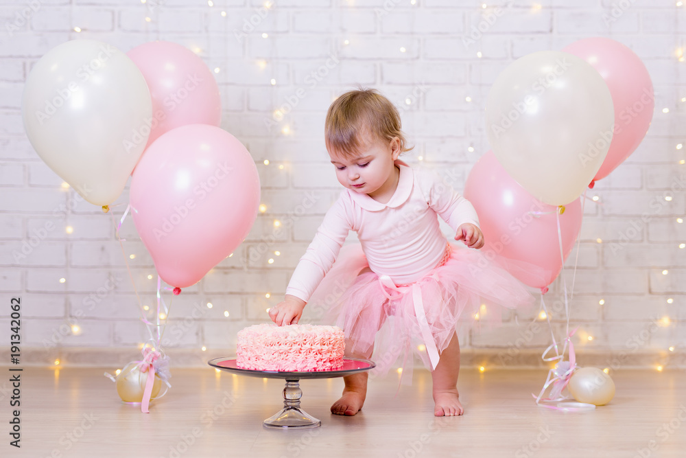 birthday celebration - funny little girl smashing cake over brick wall ...
