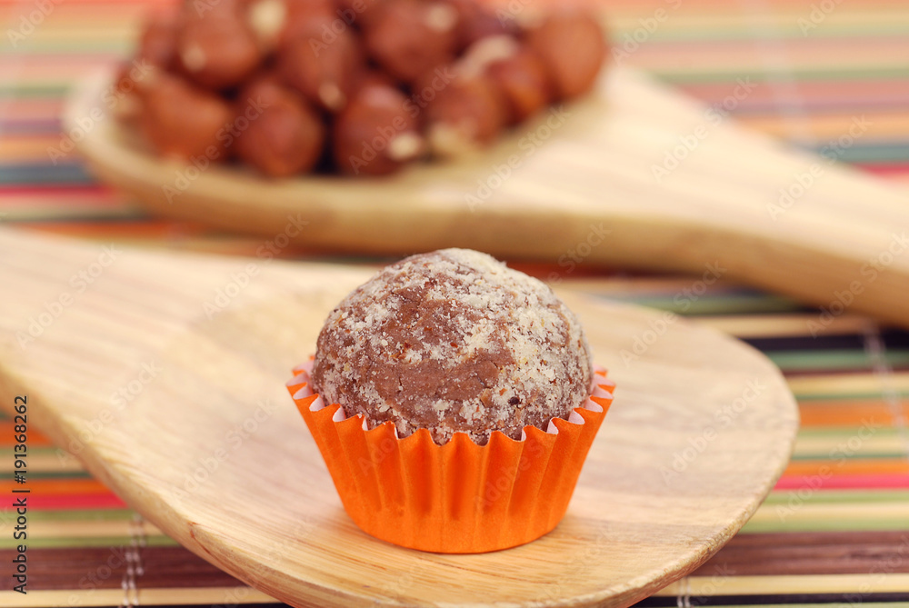 Traditional Brazilian chocolate candy called brigadeiro in hazelnut ...