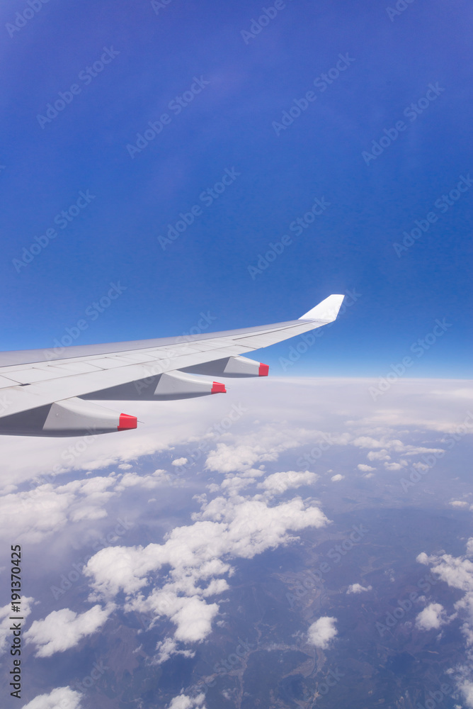 clouds sky skyscape and Wing of airplane with skyline top view. view ...