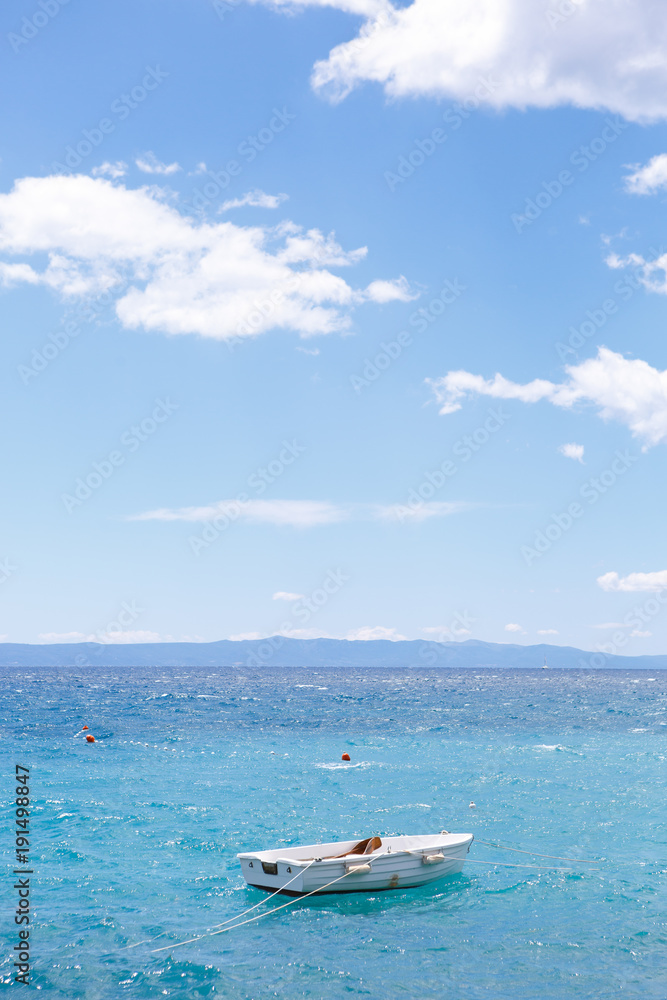 Small boat.Watercraft drifting on waves in deep blue sea of Adriatic ...