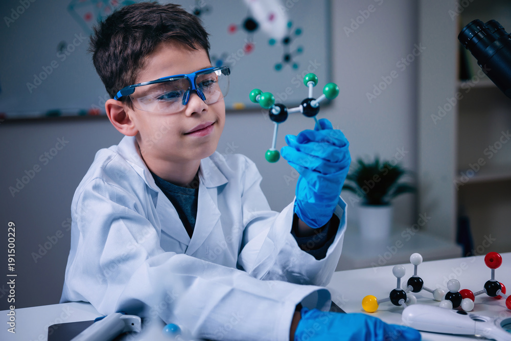 Science education. Cute boy holding molecular model Stock-Foto | Adobe ...
