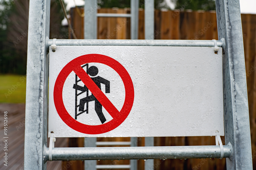 Building and metal ladder with sign NOT TO CLIMB THE LADDER Stock Photo ...