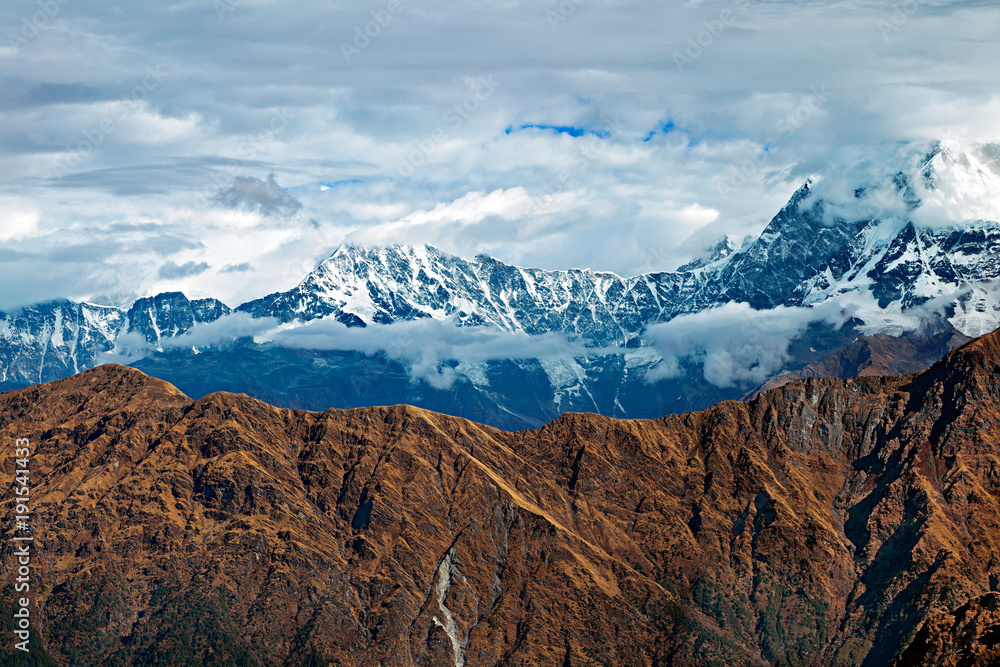 Himalayan mountain ridge with famous Chaukamba peak among clouds, the ...