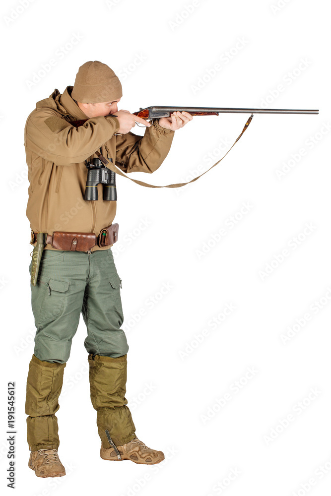 Full length portrait of a male hunter ready to hunt with hunting rifle ...