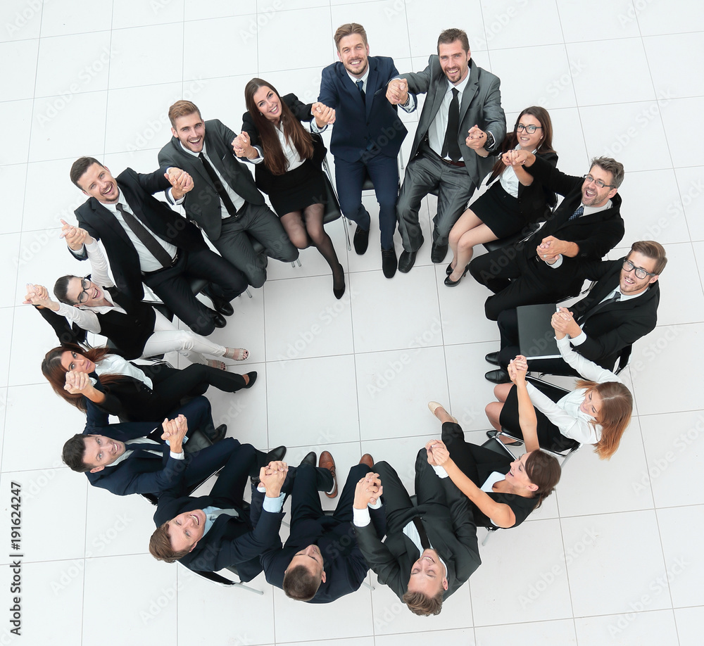 concept of team building .large successful business team sitting in a ...