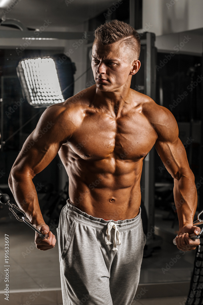 Plakát Brutal strong athletic men pumping up muscles and train in gym workout bodybuild – Obraz ...