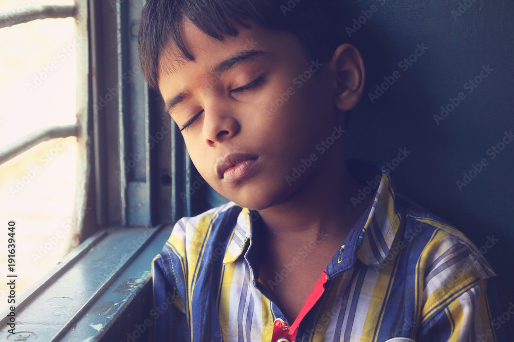 Indian Boy Sleeping in Train Stock Photo | Adobe Stock