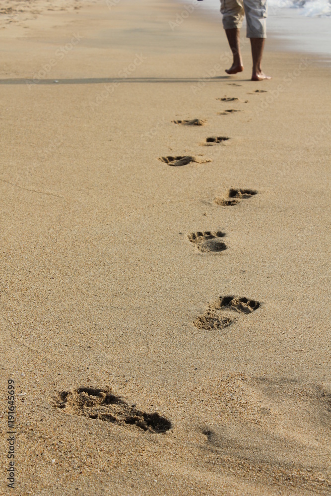 Walking Footprints In Sand