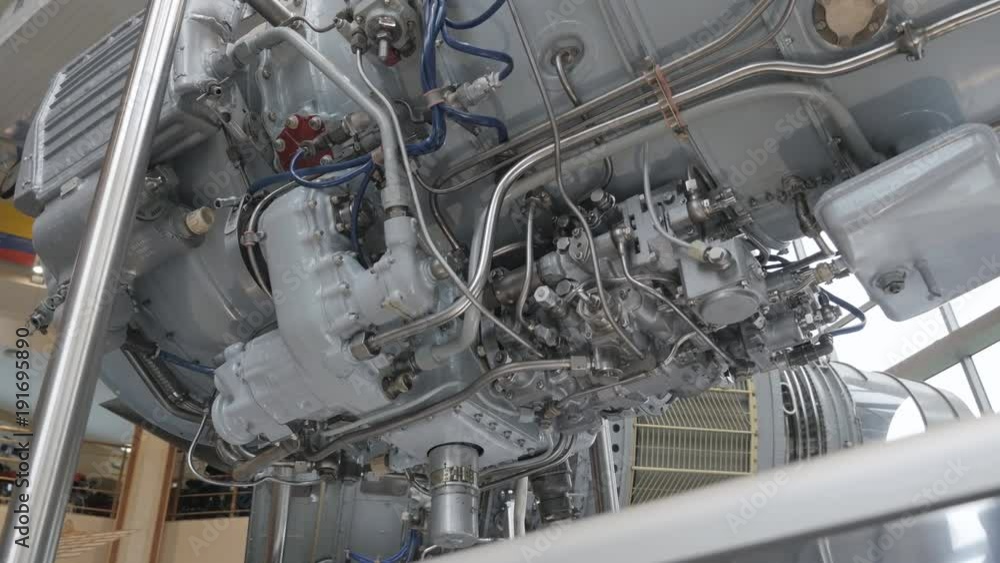 The structure of aircraft engine with lots of pipes, pumps, compressors ...