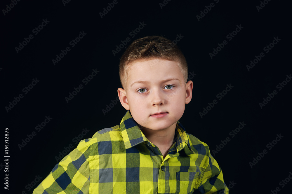 Beautiful gay boy on a dark background .Little model posing in the ...