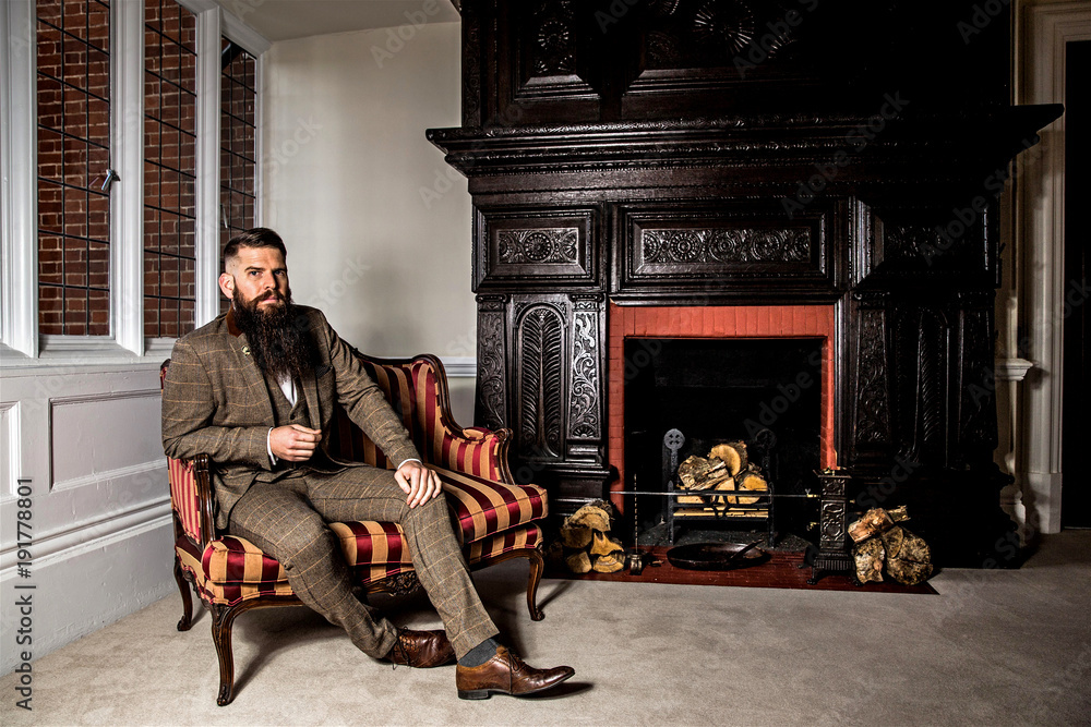 Smart man with a beard and moustache in a suit Stock Photo | Adobe Stock