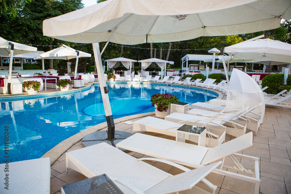 Interior of summer club with pool. Hotel pool. Resort Pool Club ...