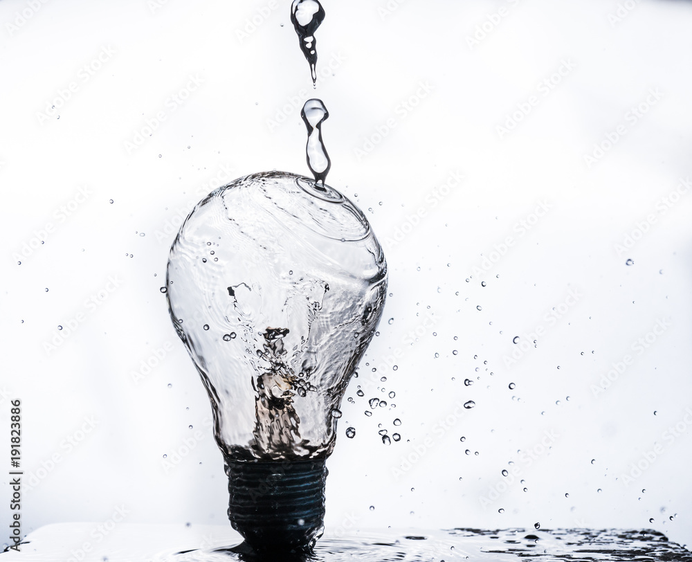 water splashing on a light bulb Stock Photo | Adobe Stock
