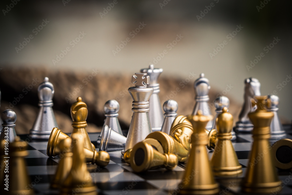 Gold and silver King and Knight of chess battle on board . Gold king ...