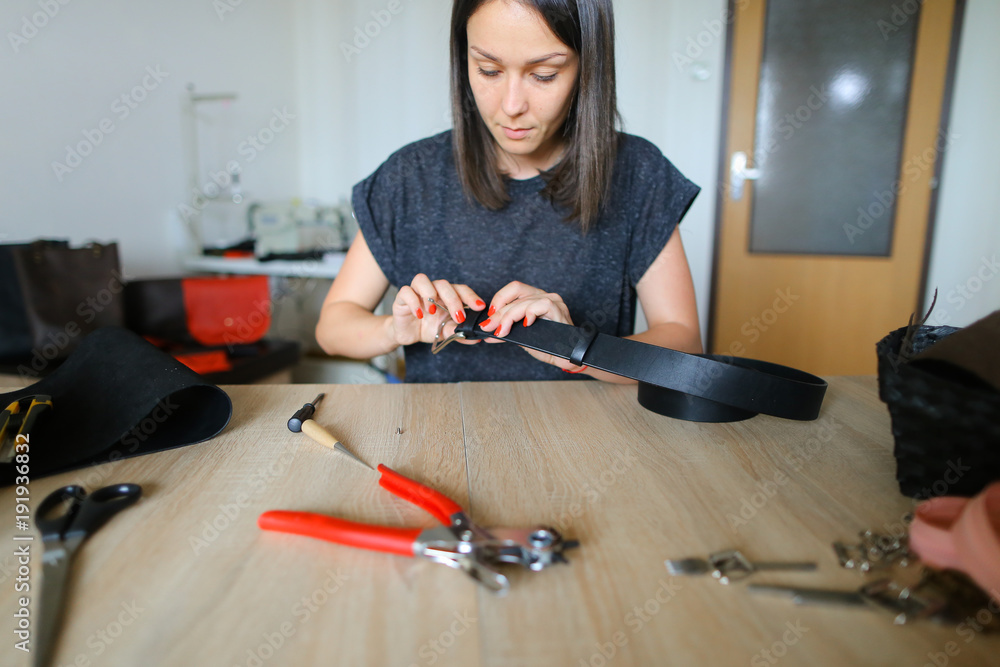 Female showing how to make stylish leather purse, blogger interested in ...