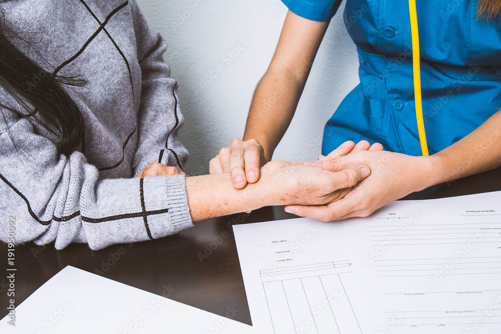 Nurse uses pulse handles at the wrists of elderly patients Stock Photo ...
