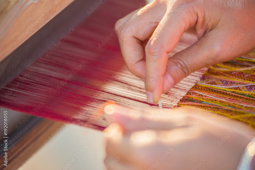 The fingers are showing the weaving style, which is the traditio Stock ...