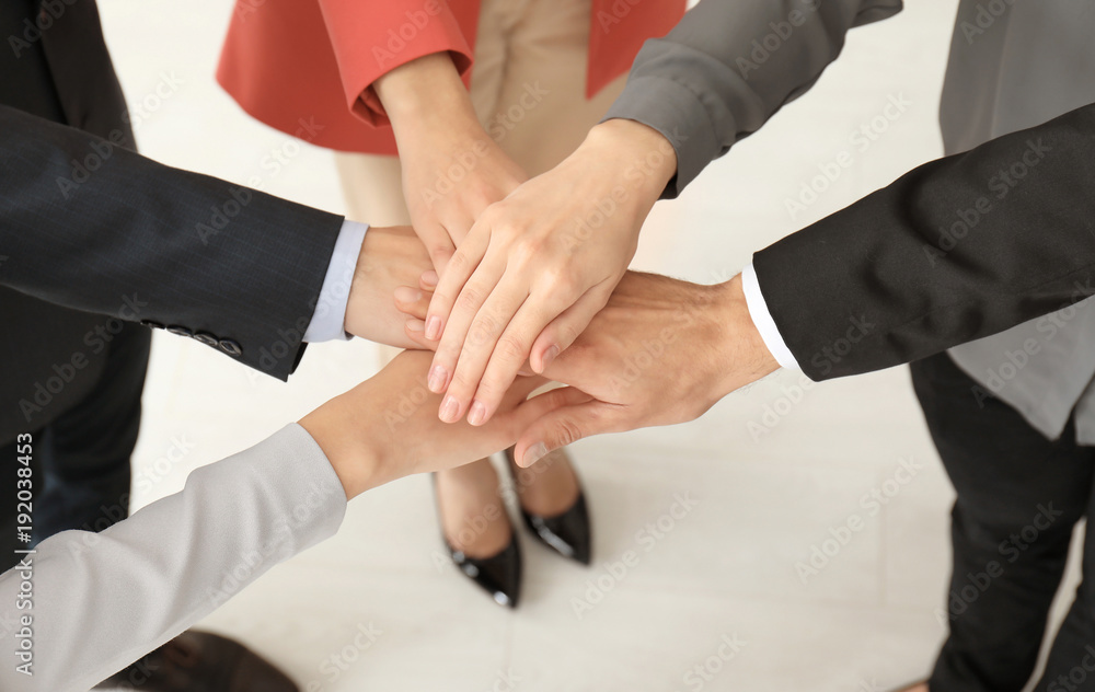 Group of people putting hands together as symbol of unity Stock Photo ...