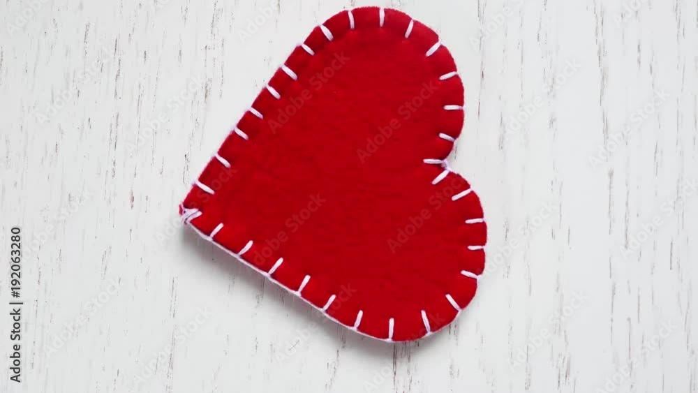 frame-by-frame shooting - the red heart of felt is lined with white ...