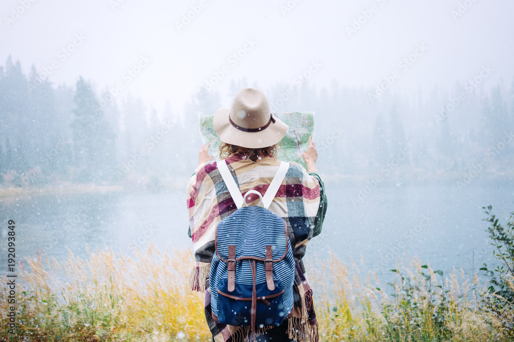 Travel woman reading map among amazing wilderness, enjoy the nature ...