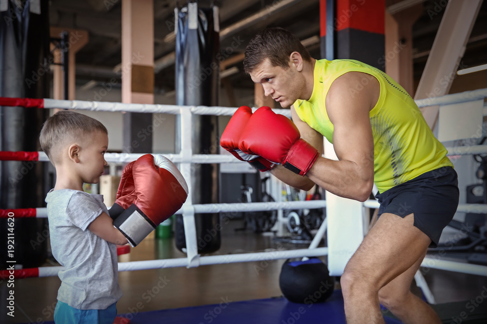 Little boy training with coach in boxing ring Stock Photo | Adobe Stock
