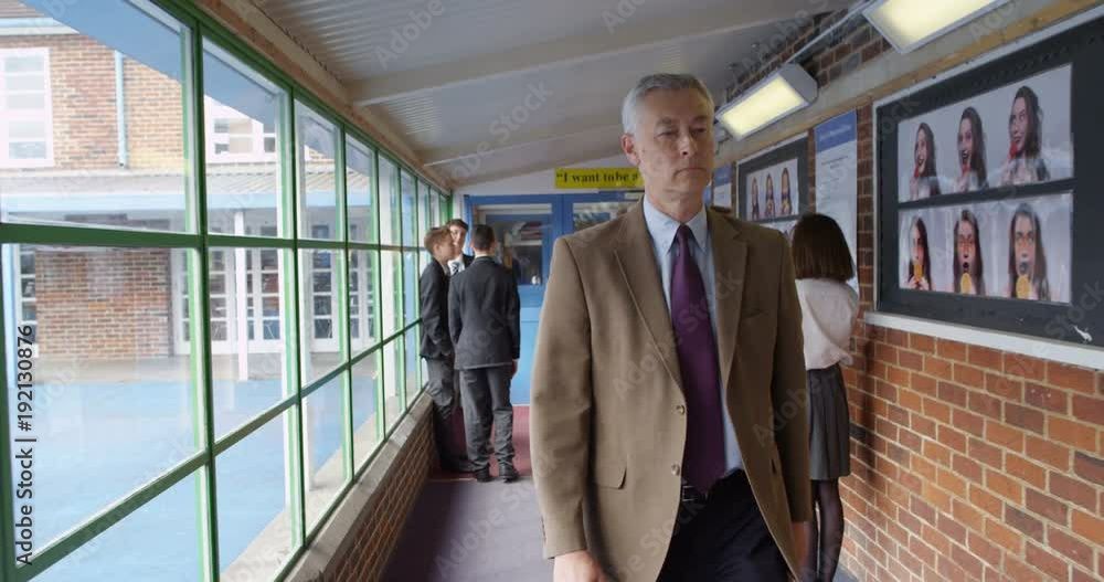 4K Strict teacher in inner city British school disciplining a pupil for ...